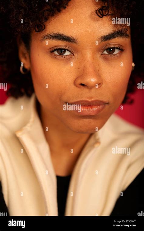 Young woman serious expression hi-res stock photography and images - Alamy