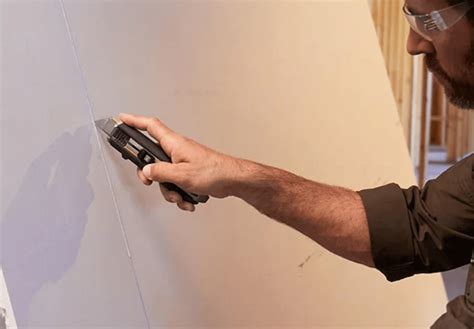 ToughBuilt's utility knife flips into a scraper at the push of a button