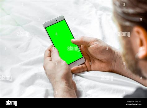 Young man back touchscreen greenscreen hi-res stock photography and images - Alamy