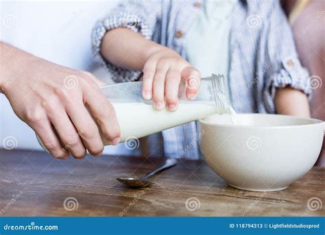 Father with Child Pouring Milk Stock Image - Image of hands, childhood: 118794313