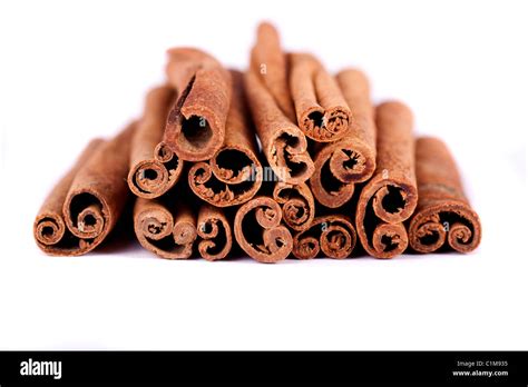 View of a bunch of cinnamon spice quills isolated on a white background ...