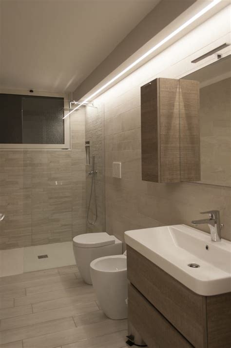 a bathroom with two toilets and a sink