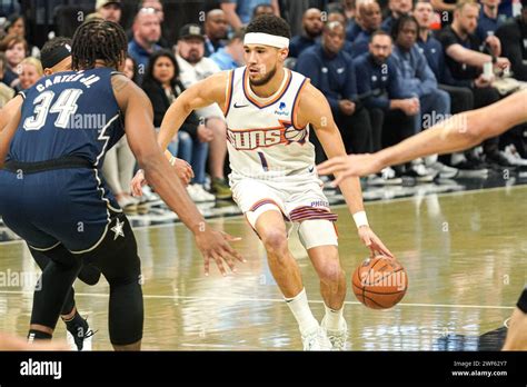 Orlando, Florida, USA, January 28, 2024, Phoenix Suns guard Devin Booker #1 rushes forward in ...