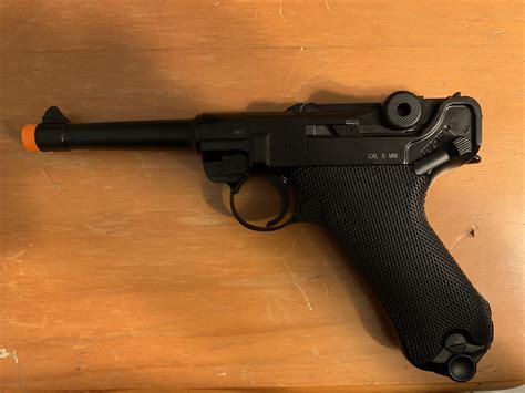 New KWC Luger P08 Co2. Fun little fella. Sticky trigger out of box, but ...