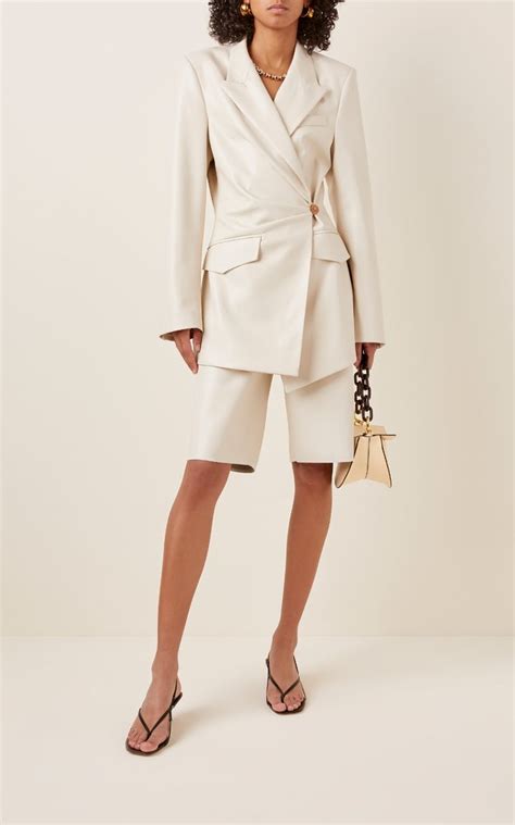 Nanushka's 'Blair' blazer is tailored from optic white leather into a ...