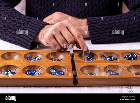 Mangala game board and glass marbles. Historical Turkish game mangala ...