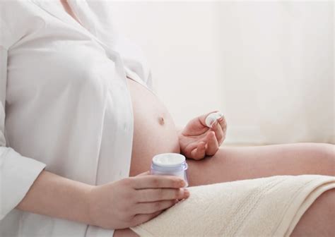 Premium Photo | Pregnant woman with cosmetic cream