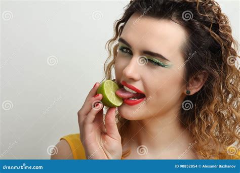 Girl with lime stock photo. Image of poses, bright, color - 90852854