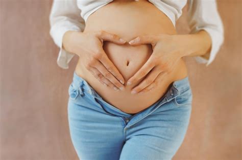 Premium Photo | Close up of pregnant belly baby expectation love ...
